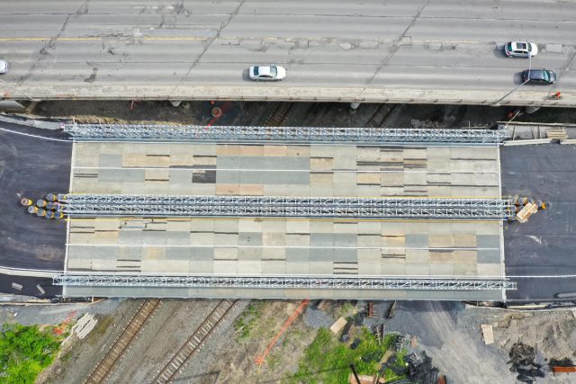 Aerial photos of temporary bridge over railroad tracks on Arsenal ...