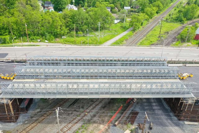 Aerial photos of temporary bridge over railroad tracks on Arsenal ...
